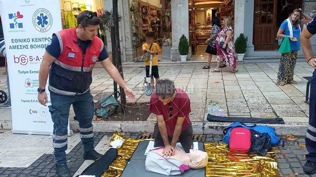 Paramedics informing and educating public about CPR and use of defibrillators